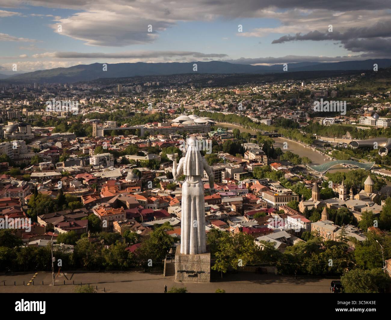 Aerial view of the Kartlis Deda statue overlooking a sprawling ...