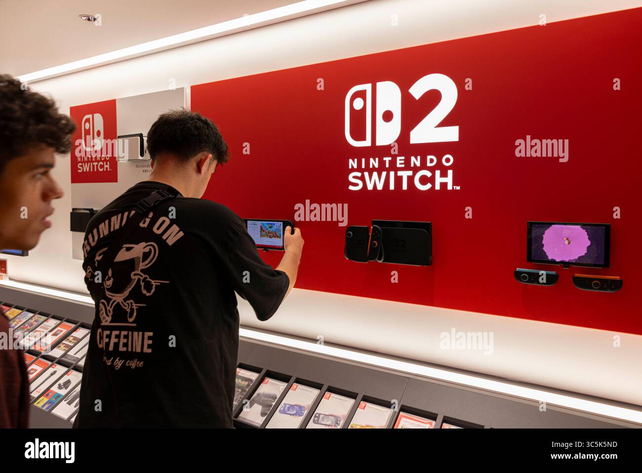 Visitors take a closer look at the newly released Nintendo Switch 2 ...