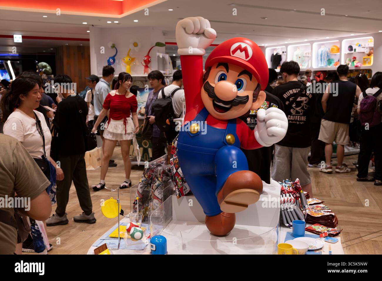 A Super Mario statue is seen inside a Nintendo store in Shibuya. Video ...