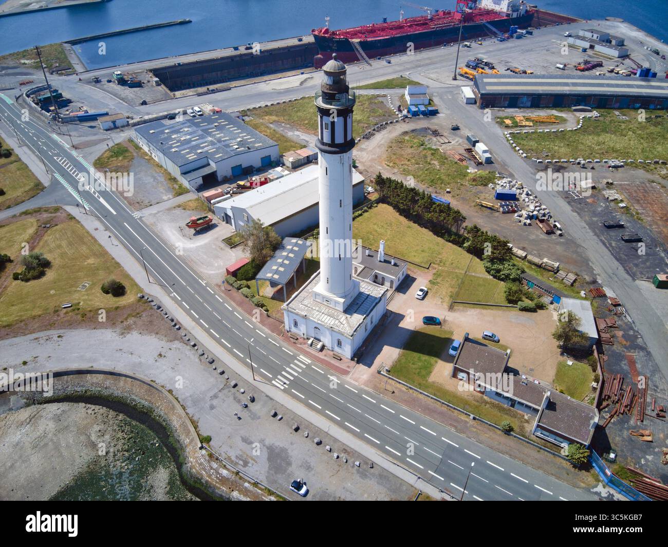 Aerial view of the striking white lighthouse standing tall against the ...