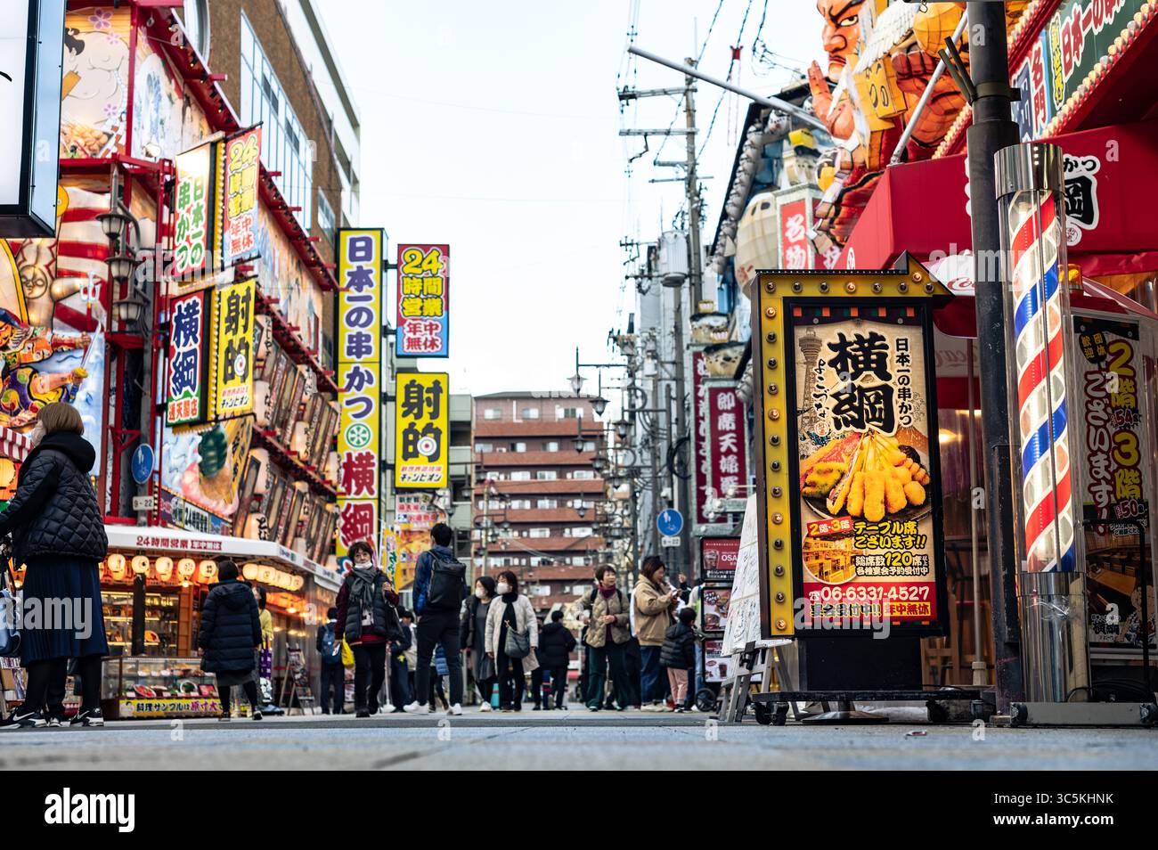 Dotonbori street view with colorful signs and people, Osaka, Japan ...