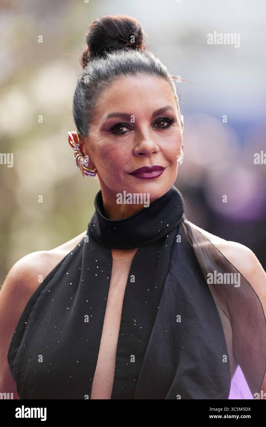 Catherine Zeta-Jones poses for photographers upon arrival at the ...