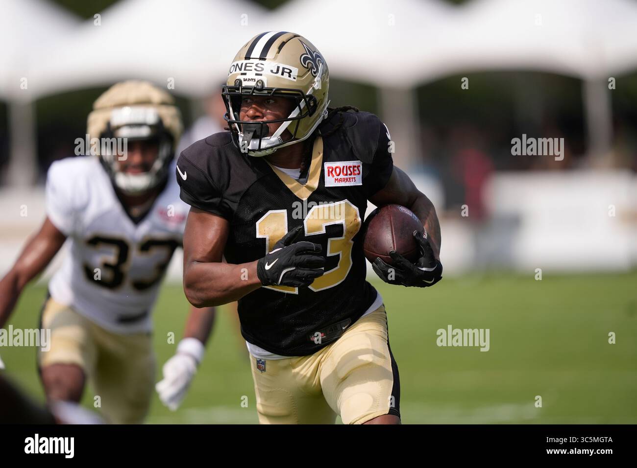 New Orleans Saints running back Velus Jones Jr. (13) goes through ...