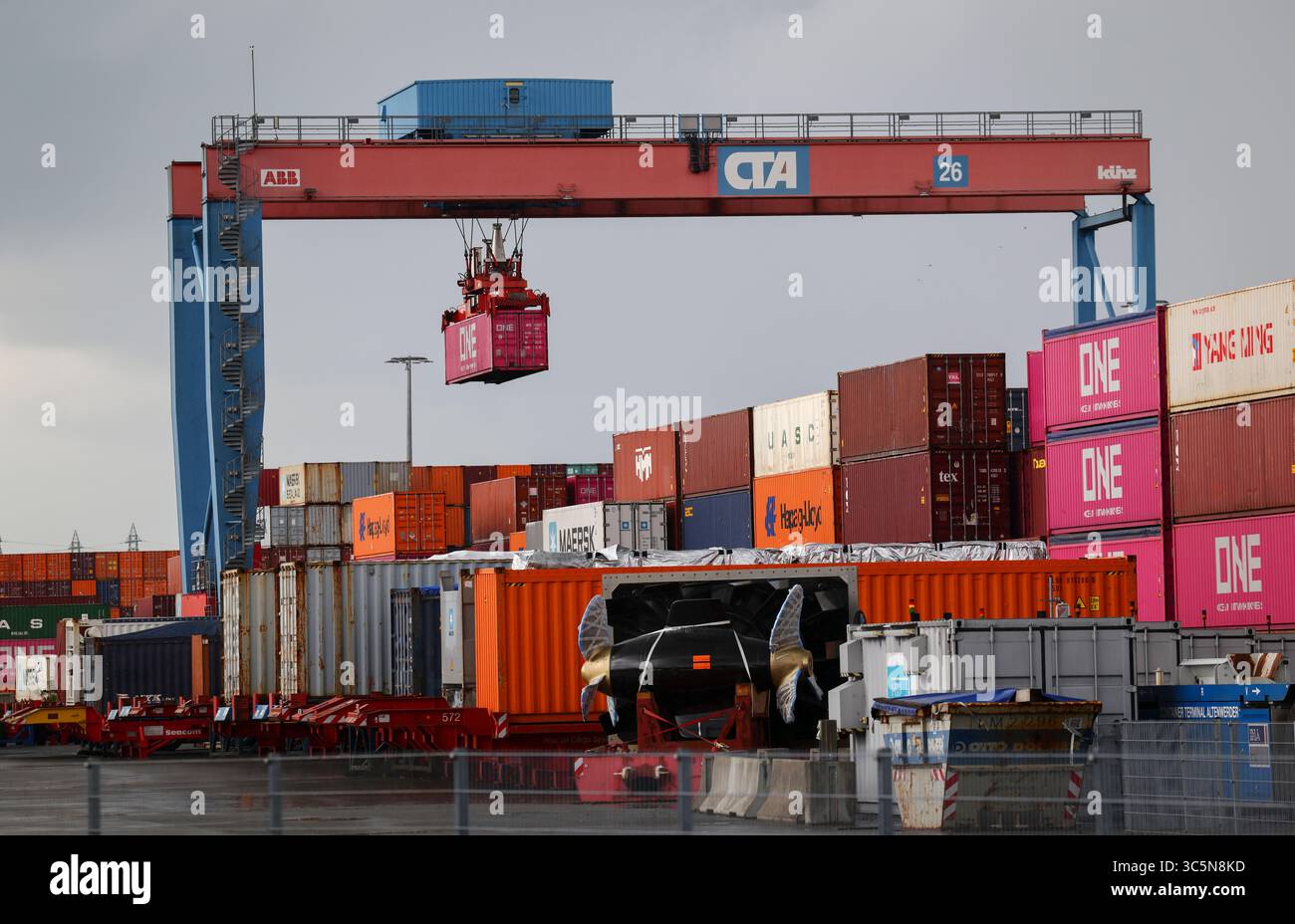 29 July 2025, Hamburg: Containers are handled at the Container Terminal Altenwerder (CTA) of ...