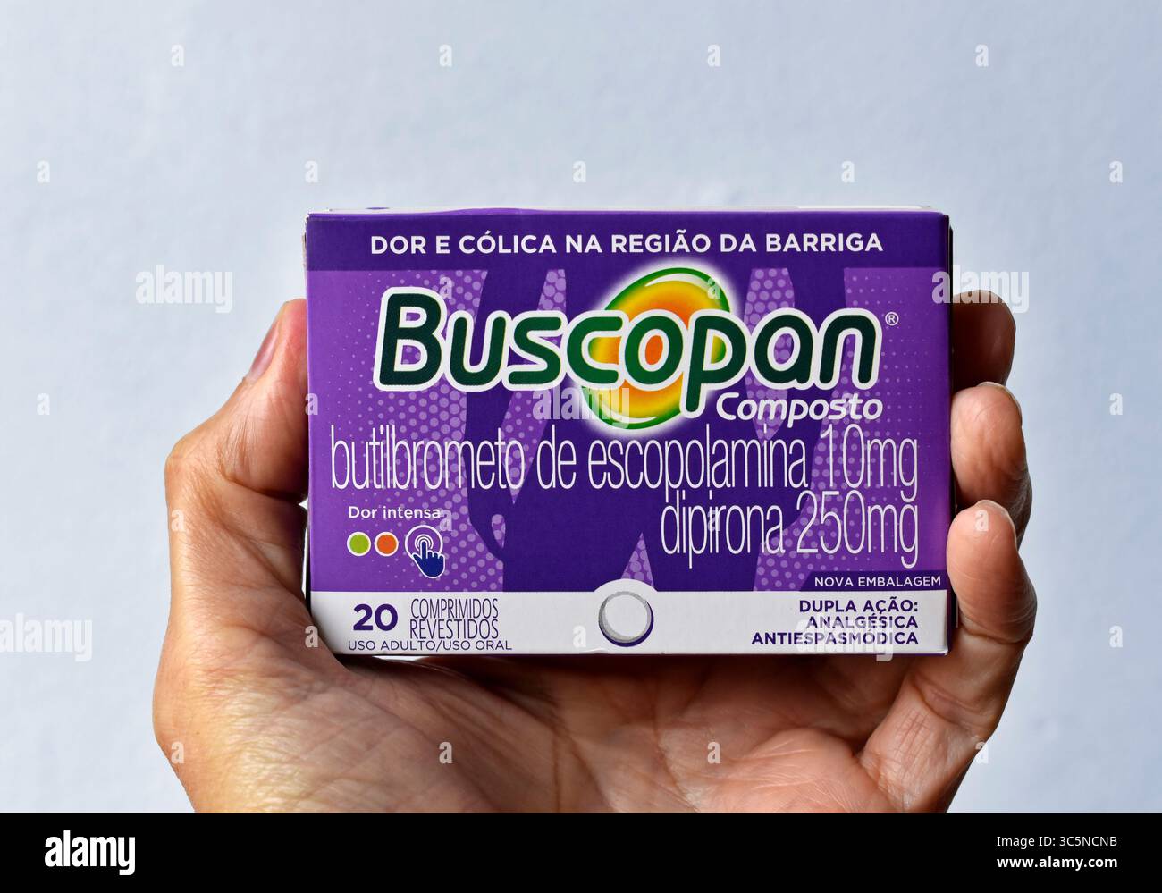 RIO DE JANEIRO, BRAZIL - July 25, 2025: Hand holding a box of Buscopan ...