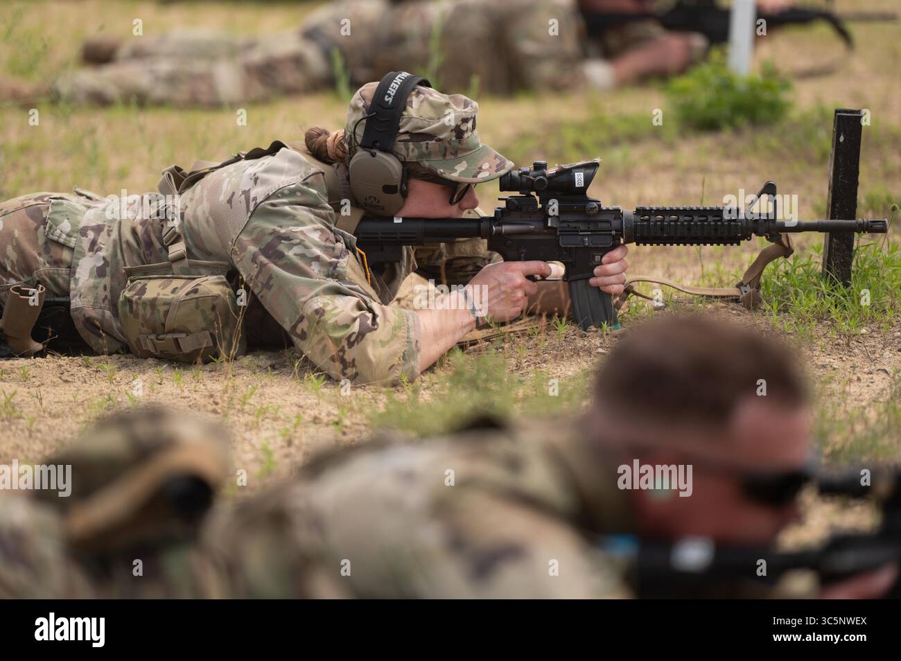 Fort Devens, Massachusetts, USA. 16th July, 2025. Army Sgt. Sarah Hanson fires at a target from ...
