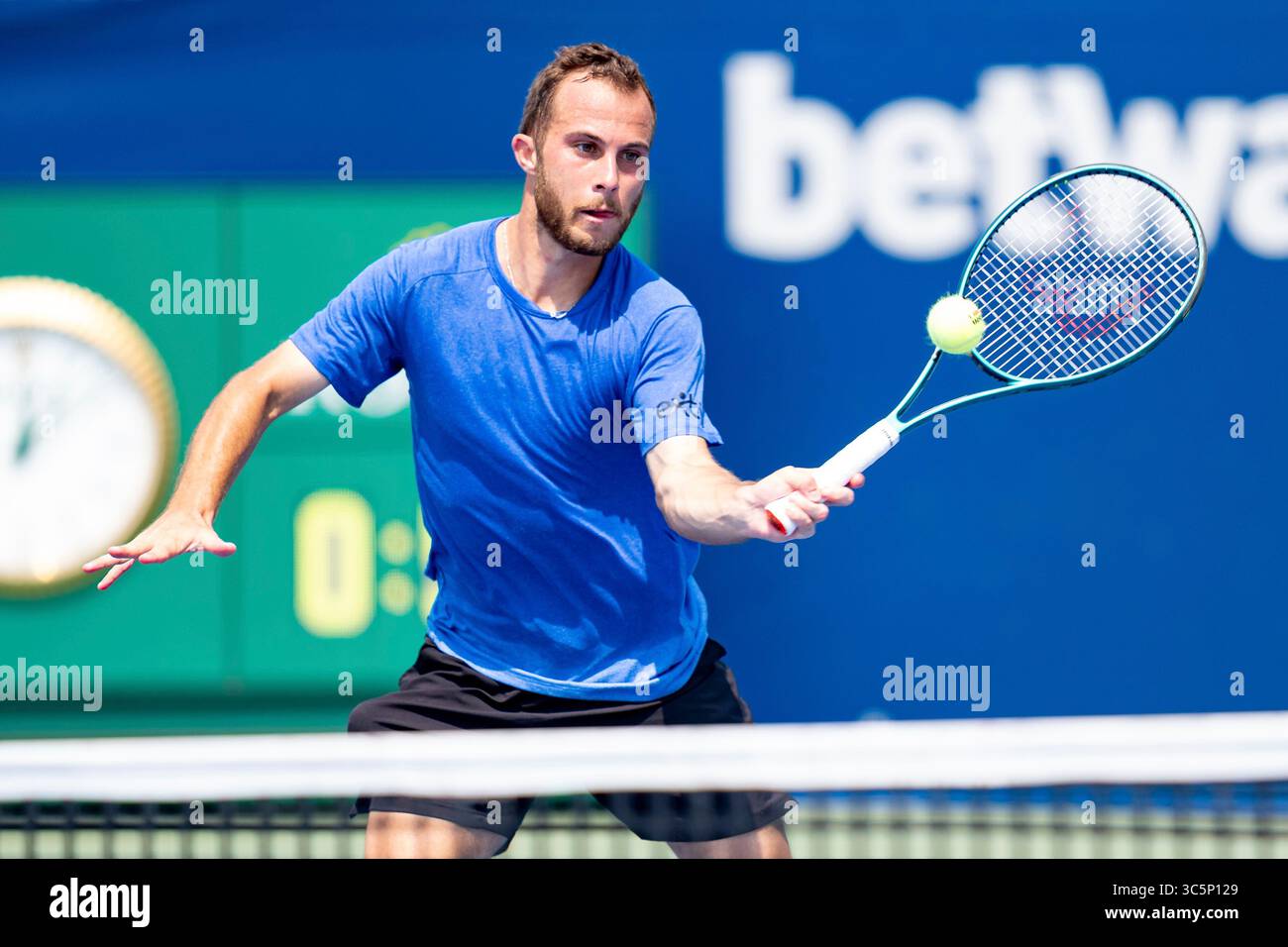 TORONTO, ON - JULY 30: Hugo Gaston (FRA) returns the ball during his ...