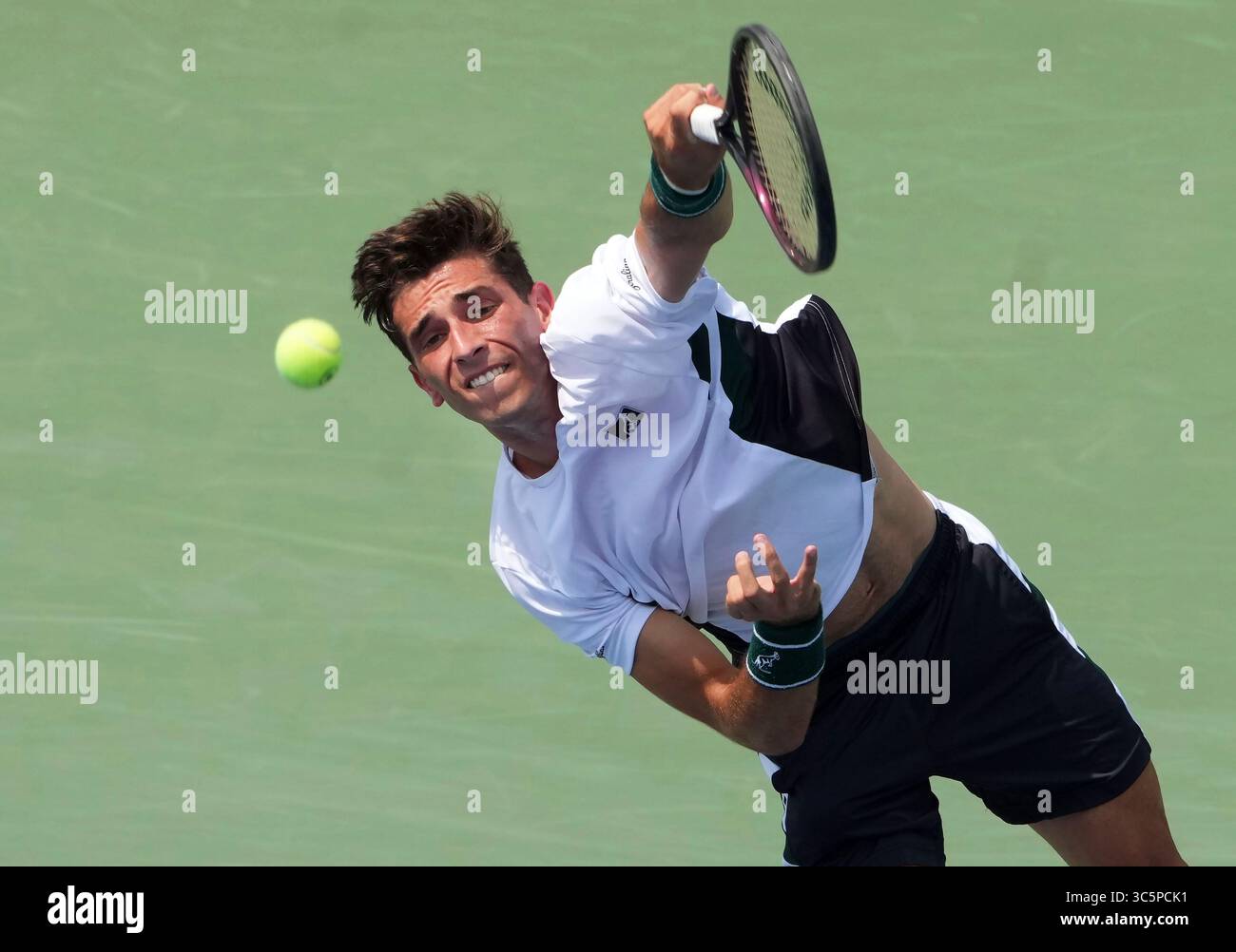 Matteo Gigante, of Italy serves to Gabriel Diallo, of Canada, during a ...