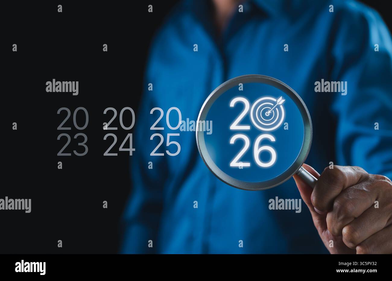 The 2026 New Year business goals concept. Magnifying glass focus year ...