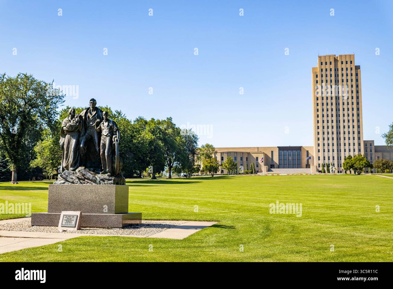 Bismarck, ND, USA - July 08, 2025: The Pioneer Family statue, sculpted ...