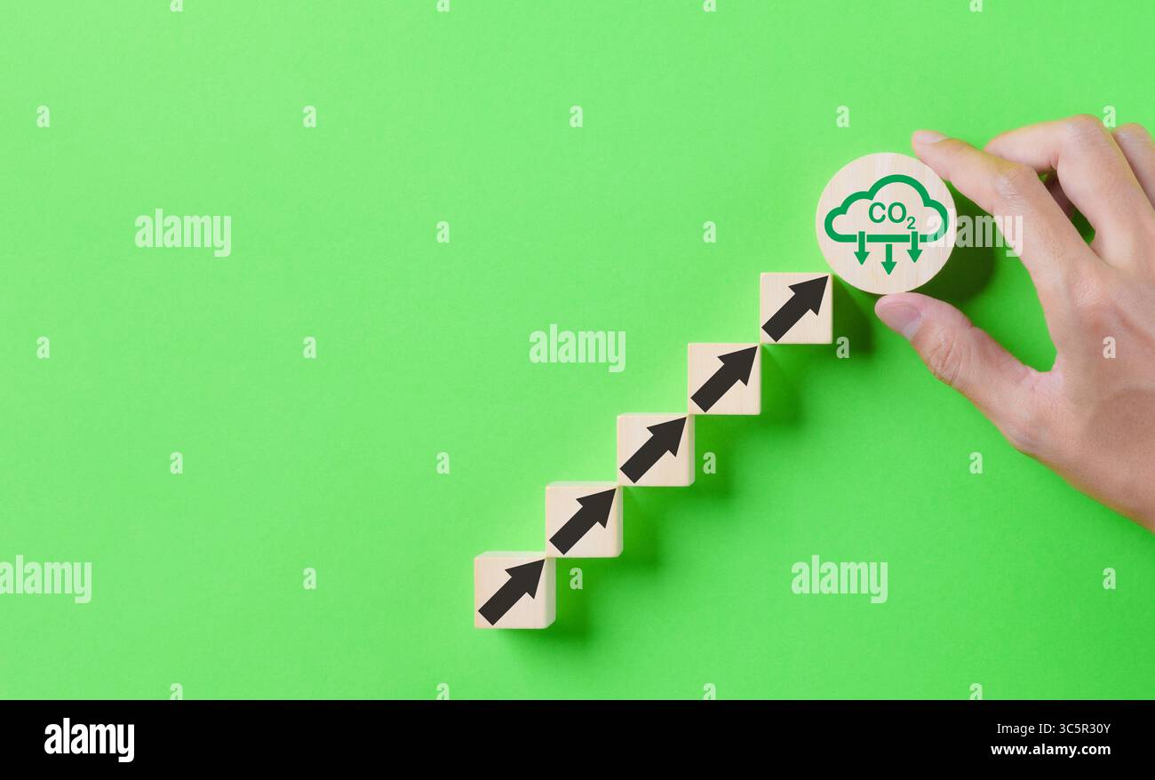 Hand placed CO2 reduction icon with arrow up for decrease CO2. Net zero ...
