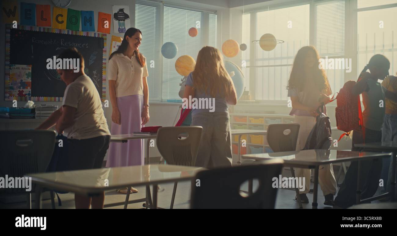 Female Teacher Finishing the Lesson, Announcing the End of School Day ...