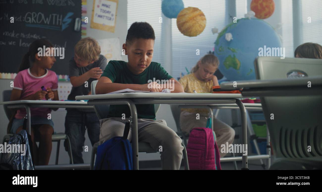 Stressed African American Primary School Boy Sitting Alone at Desk ...
