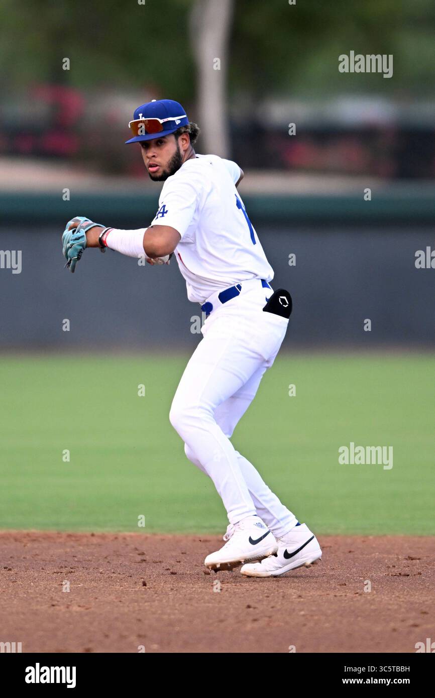 ACL Dodgers shortstop Emil Morales (11) throws to first base during an ...