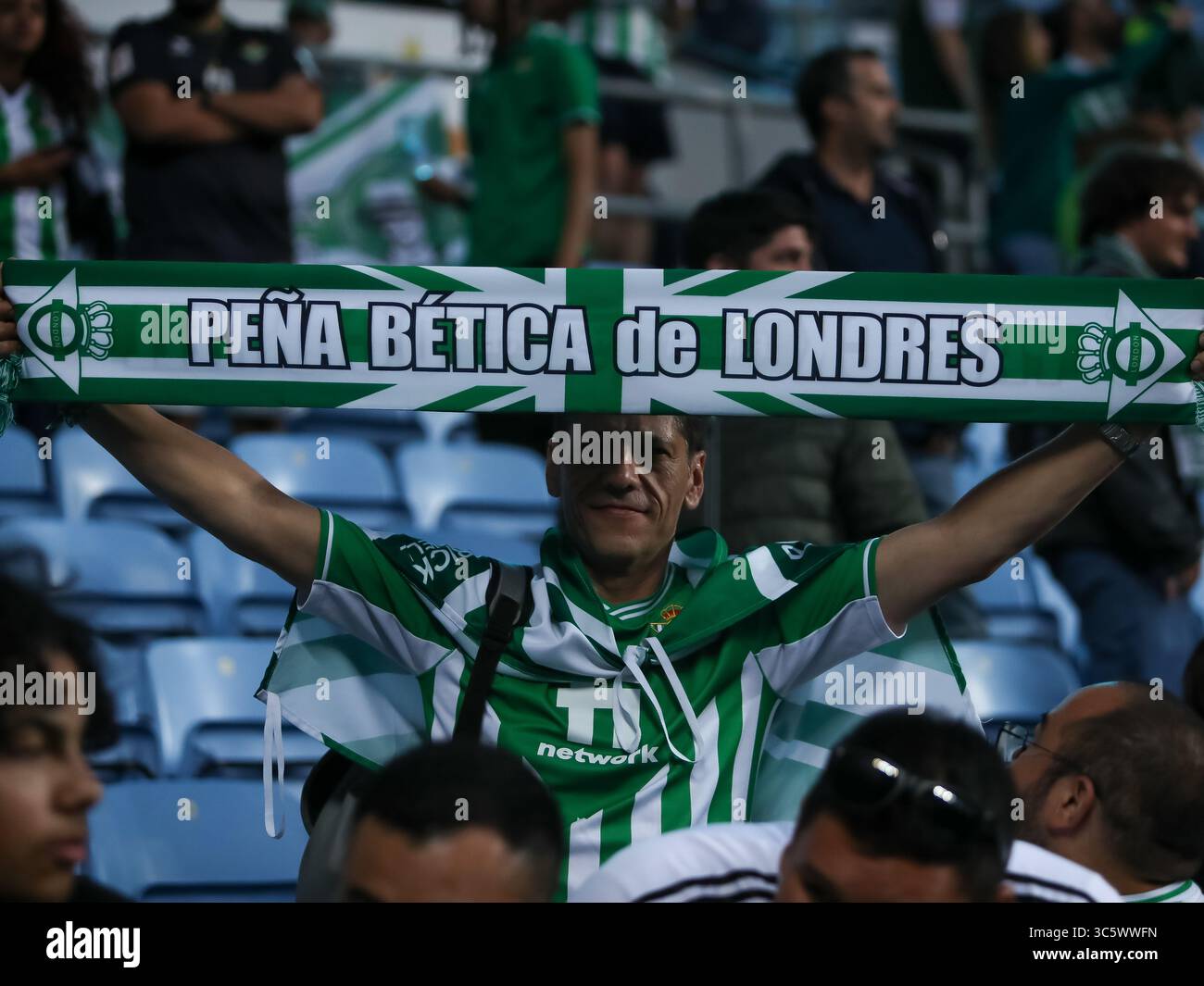 Coventry, UK. 30th July 2025. A Real Betis fan holds up his flag after ...