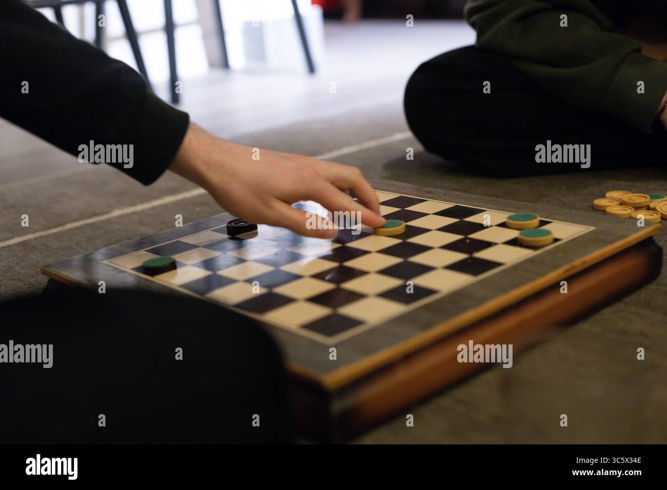 Strategic Checkers Move in Natural Light Stock Photo - Alamy
