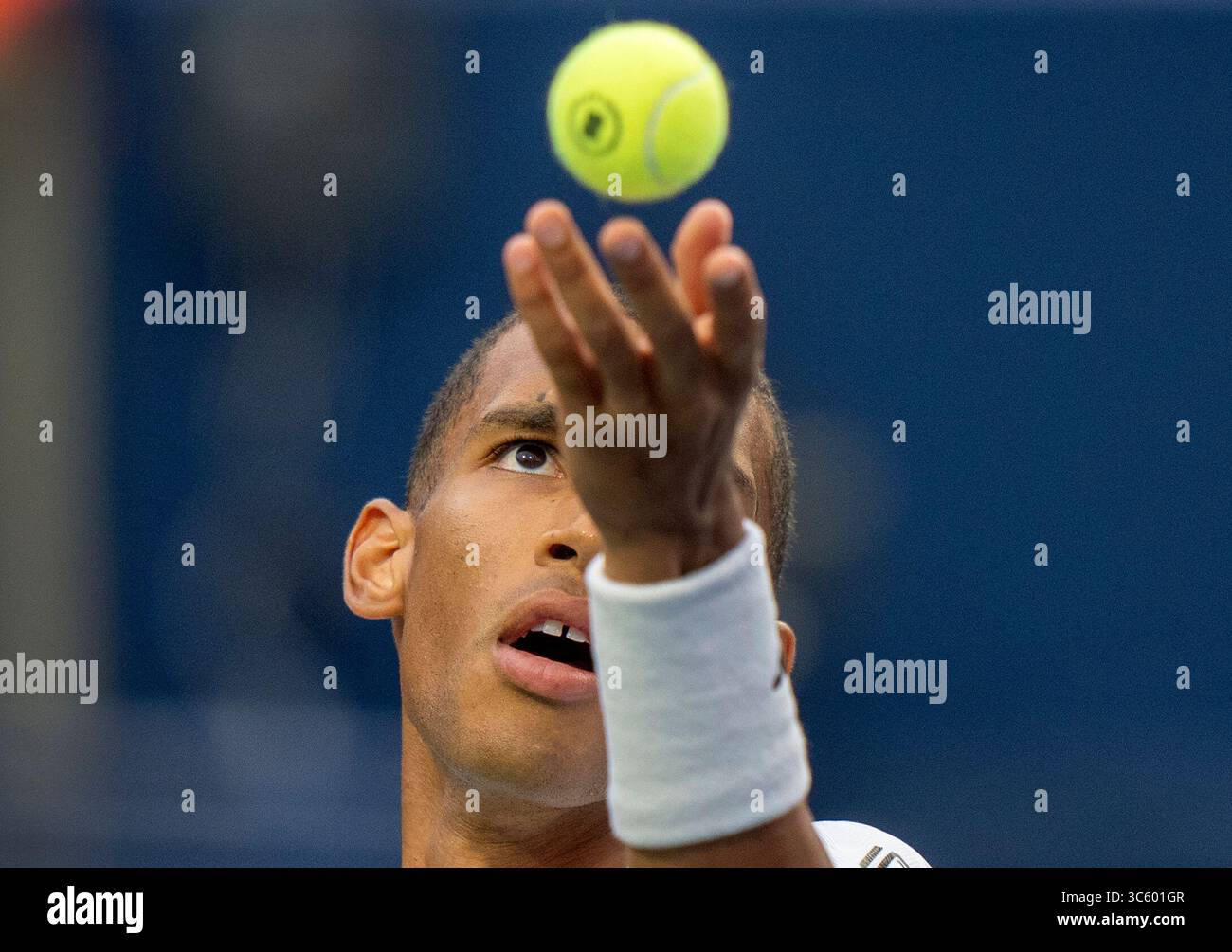 Felix Auger-Aliassime of Canada tosses the ball to serve to Fabian ...