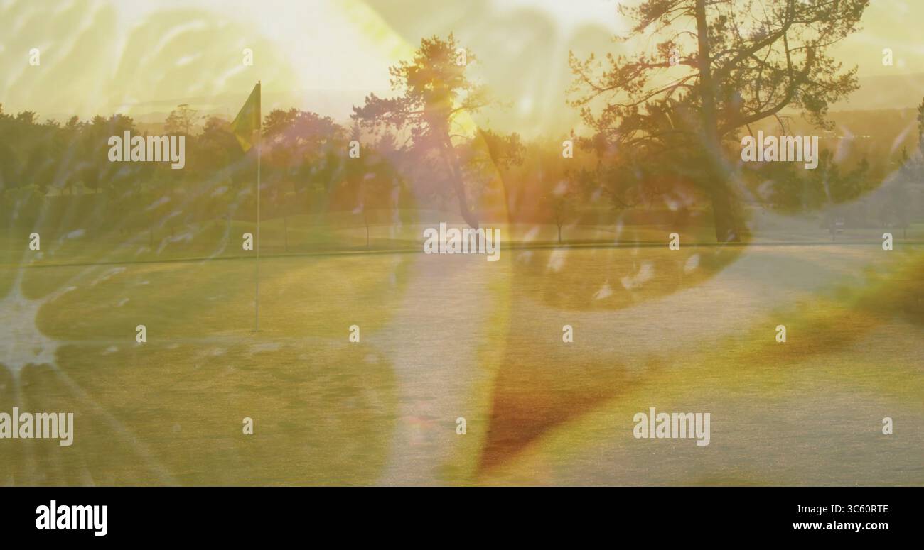 Casting long dawn shadows, flagstick standing on putting green, with ...