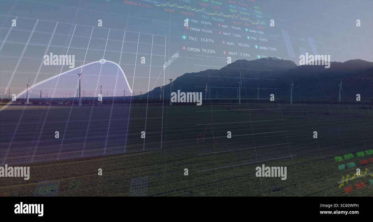 Showing row of white wind turbines standing on farmland at mountain ...
