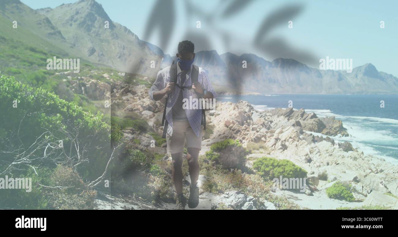 Adjusting backpack straps, male hiker navigating rocky coastal trail ...