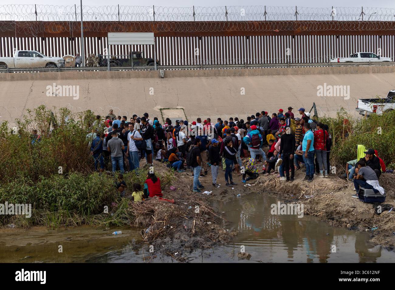 Civilians gather by the Rio Grande at the Ciudad Juarez border, amidst ...