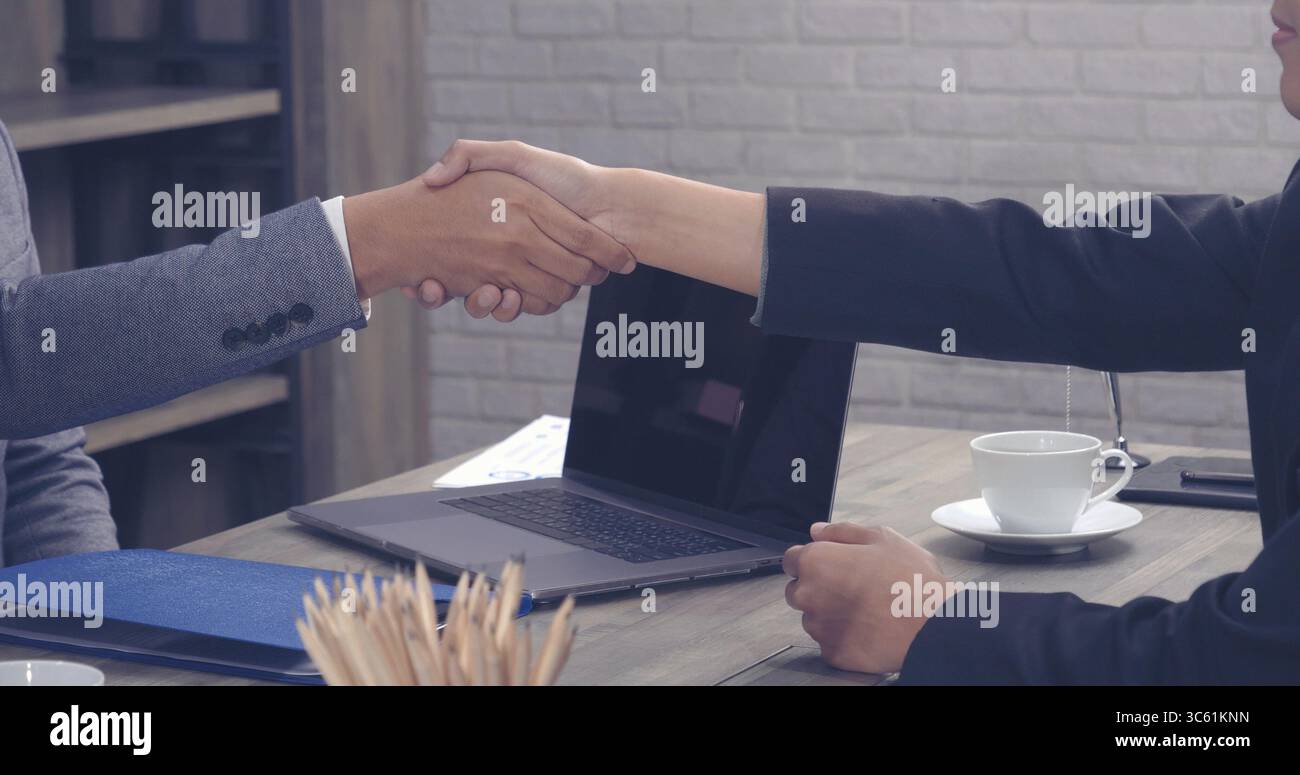 Team Business Partners shaking hands together to Greeting Start up new ...