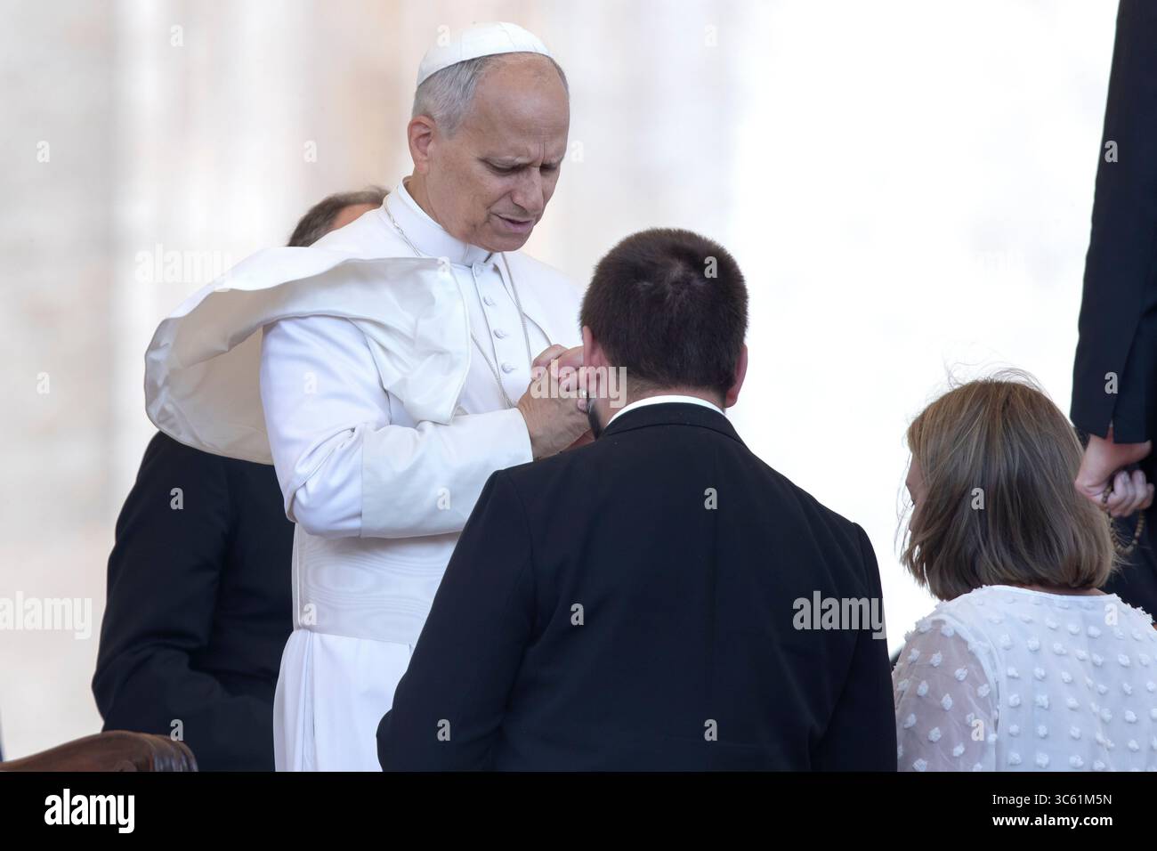 Pope Leo XIV blesses a married couple during his weekly general audience in St. Peter's Square ...
