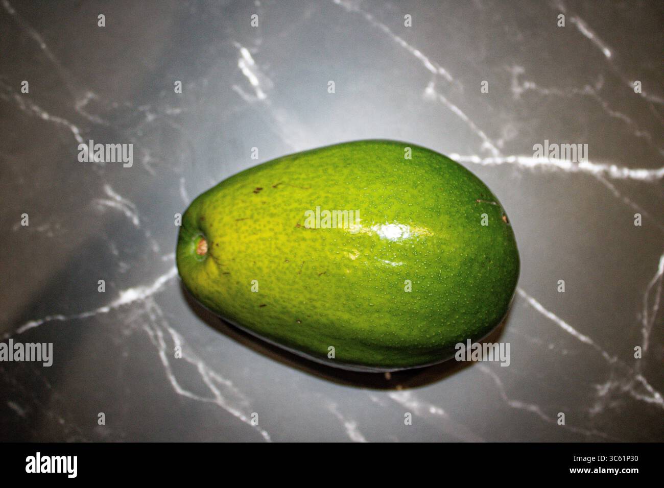Avocado also known as Alligator Pear or Butter Fruit Stock Photo - Alamy