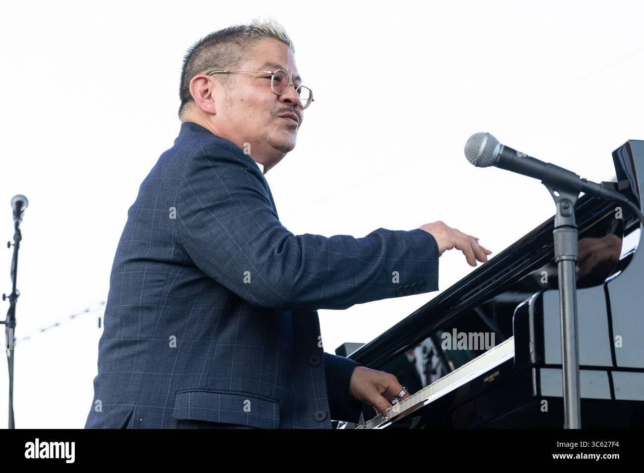 Thomas Lauderdale performs with Pink Martini band on stage on Rooftop ...