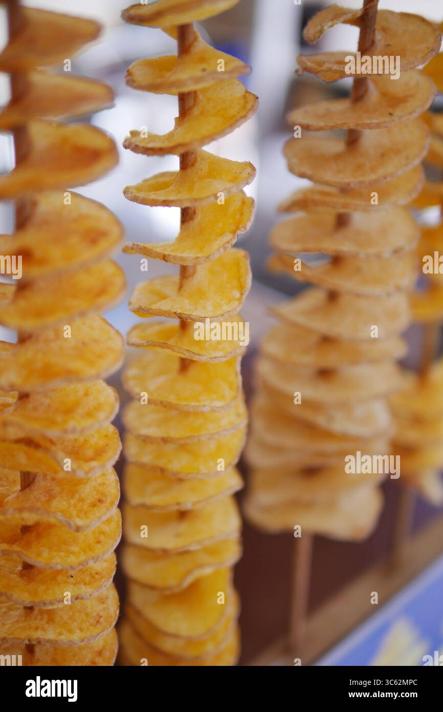 Crispy spiral potato snacks being sold at a market Stock Photo - Alamy