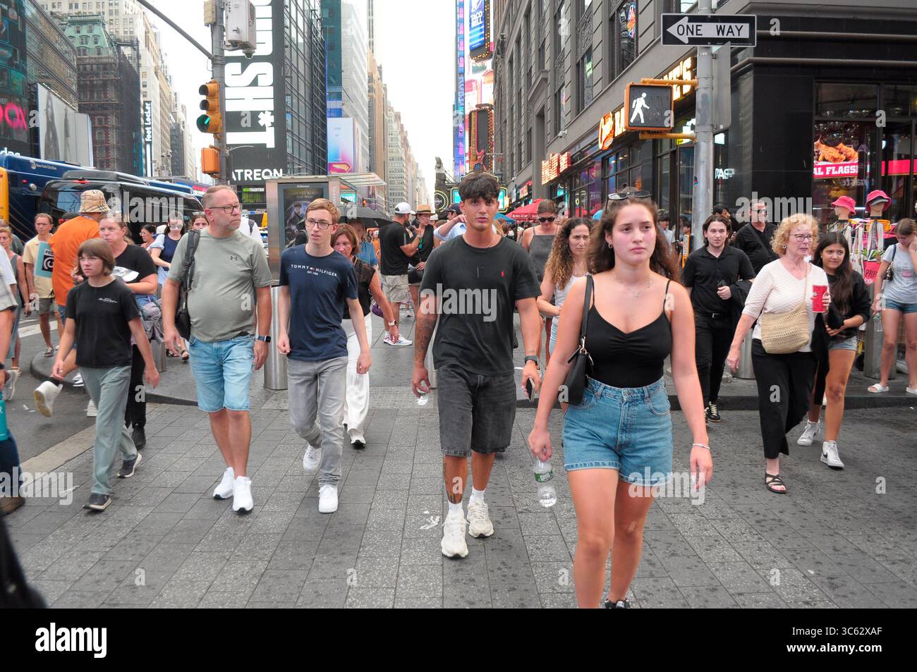 People walk in Times Square Stock Photo - Alamy