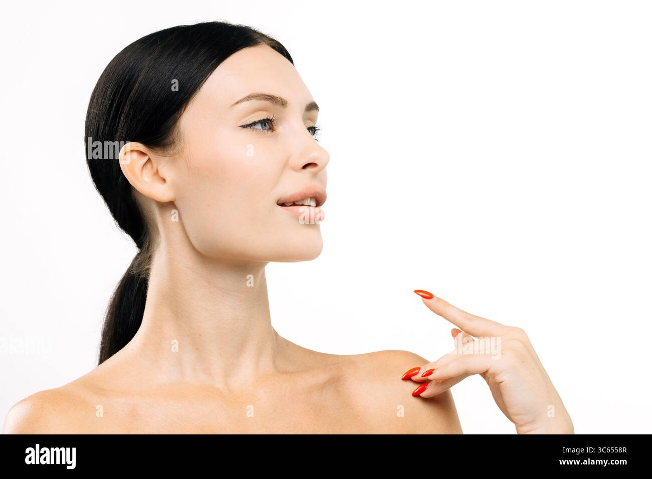 Woman with clear skin and long black hair poses elegantly, highlighting ...