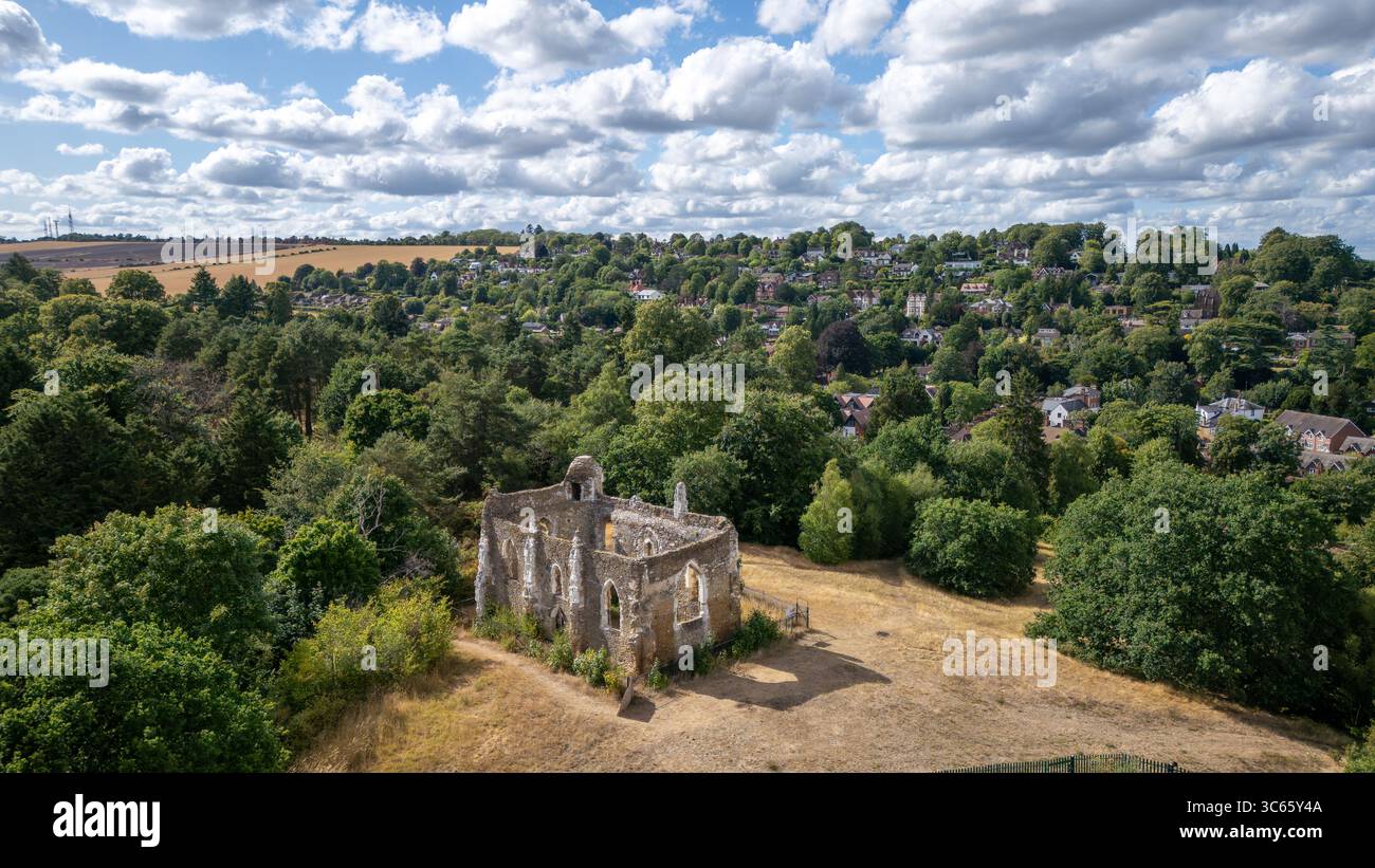 Aerial view of the stark grey ruins of St. Catherine's Chapel amidst ...