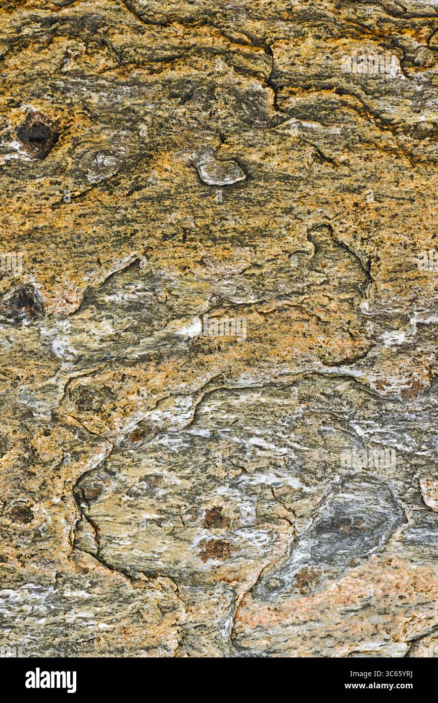 Natural rock surface reveals beautiful textures and colors, indicating ...