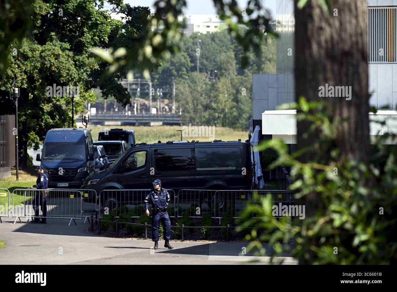 Police secures outside Finlandia Hall which hosts the Helsinki+50 ...