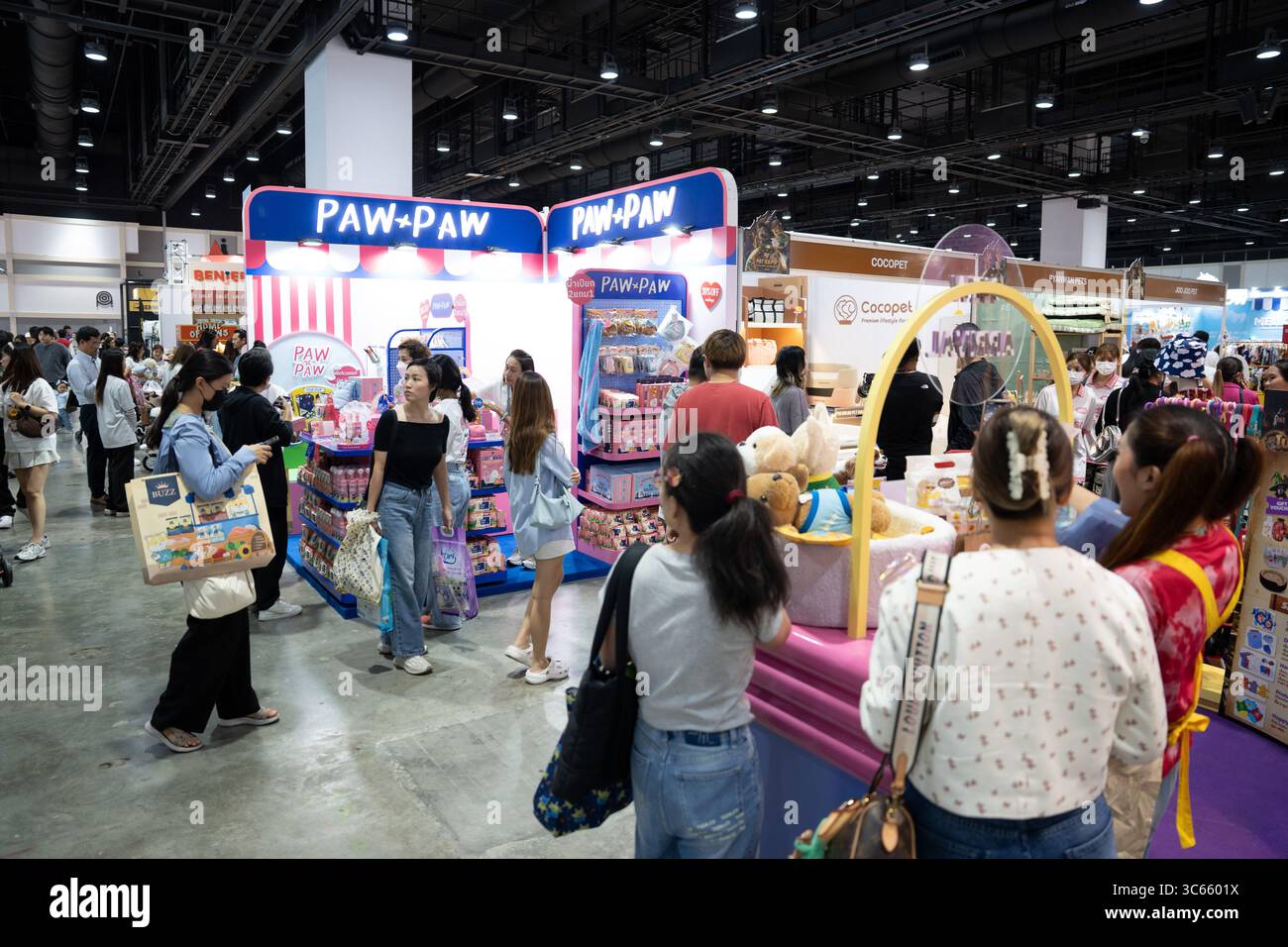 Visitors explore pet accessory and toy booths at the Pet Expo Championship 2025 at Queen Sirikit ...