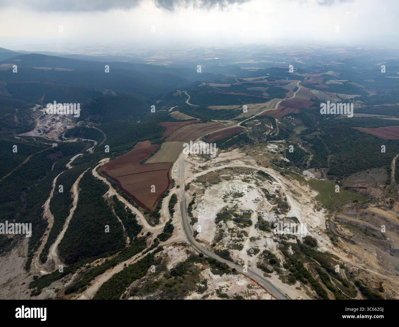 Aerial view of the landscape where roads meander through the rugged ...