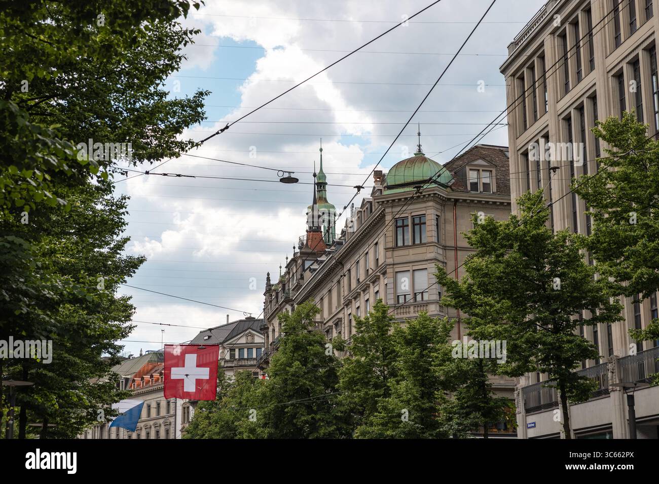 The Swiss flag flies above the popular shopping street in Zurich ...
