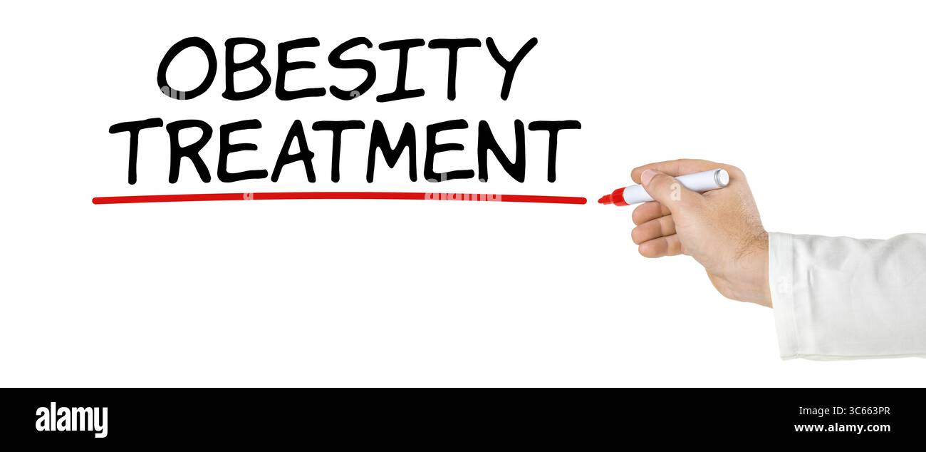 Hand with pen writing Obesity treatment Stock Photo - Alamy