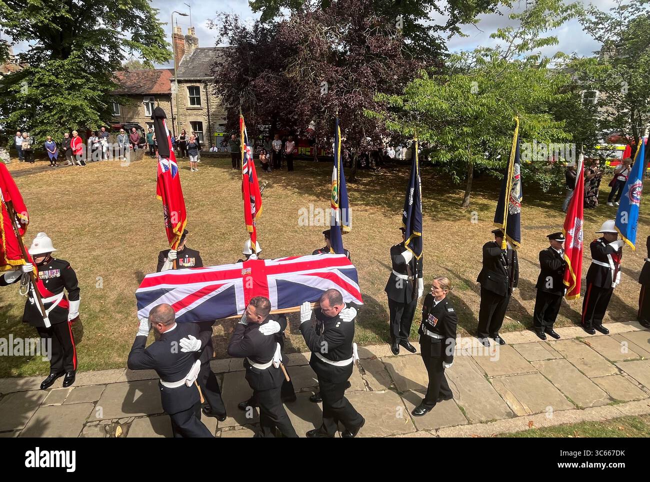 The coffin of firefighter Martyn Sadler is carried into St Edburg's ...