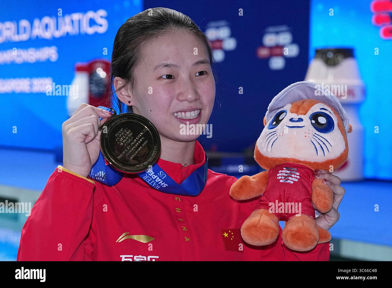 Chen Yuxi of China poses with her gold medal following the women's 10m ...