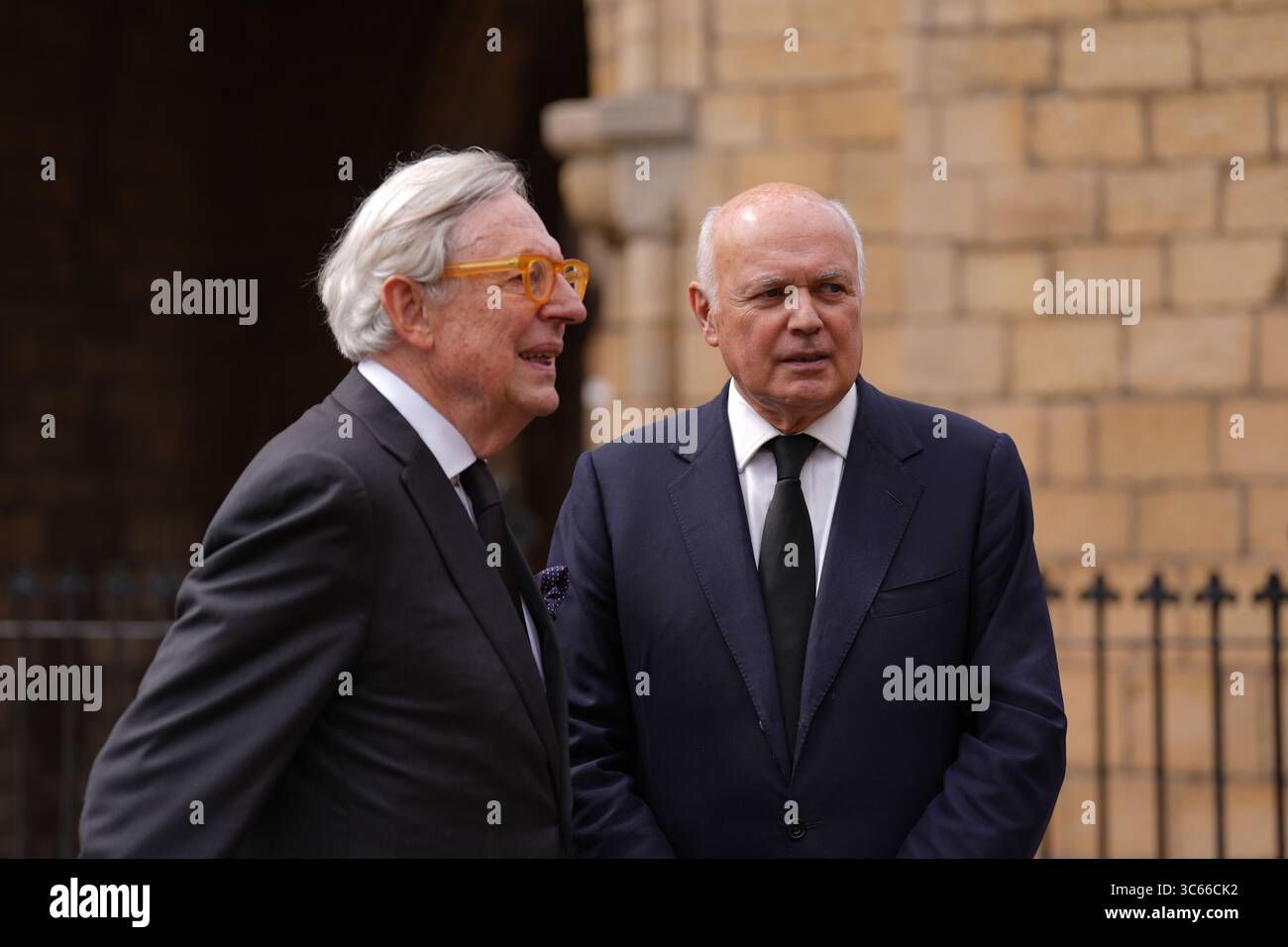 Sir Iain Duncan Smith (right) departs the funeral of Lord Norman Tebbit ...