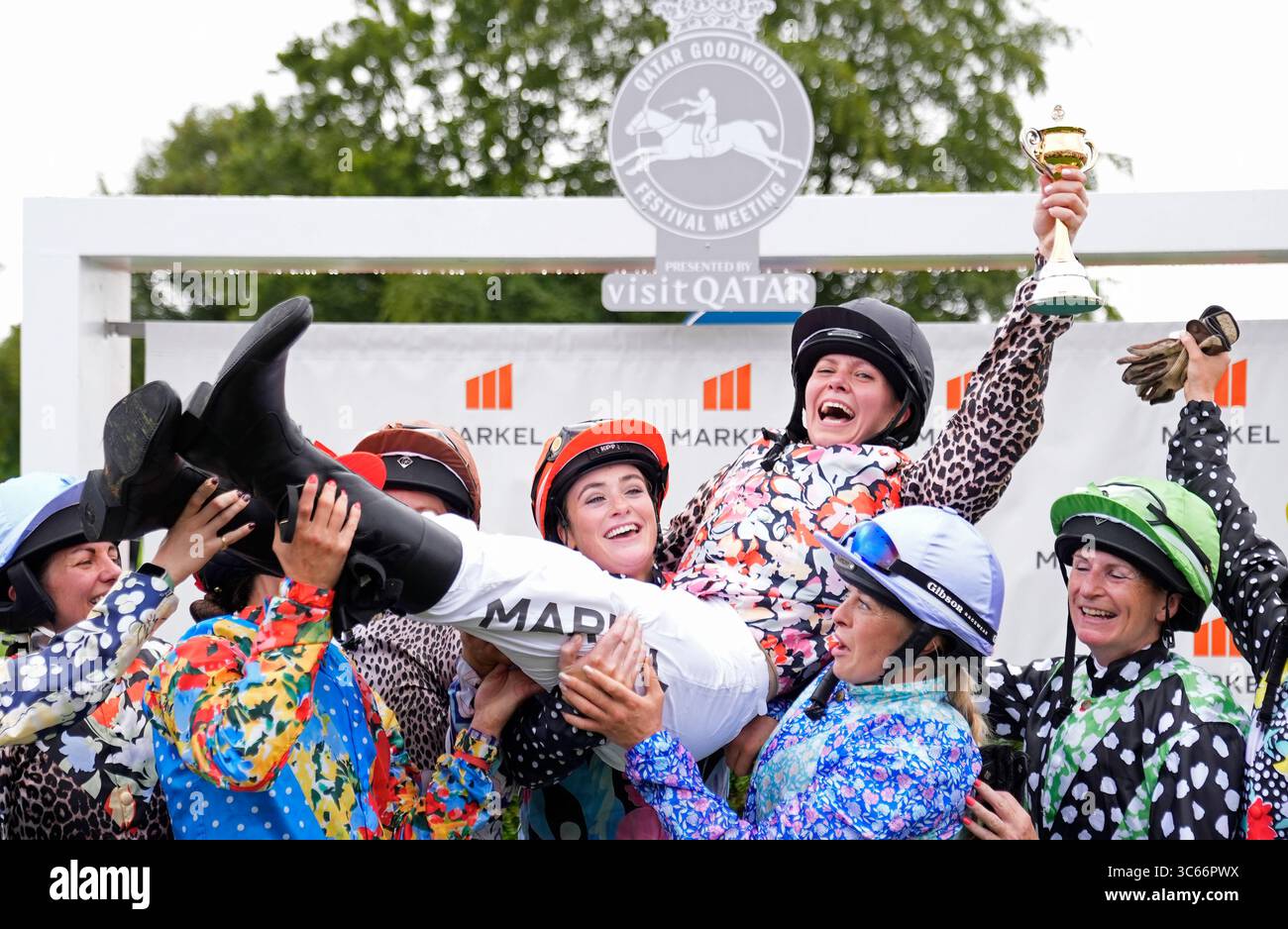Jockey Sophie Forsyth (centre) celebrates with the trophy and other ...