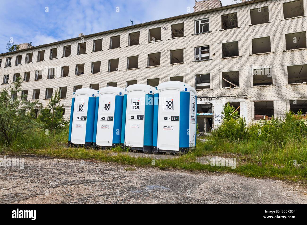 Portable Toilets in Front of Abandoned Soviet Apartment Block. Irbene ...