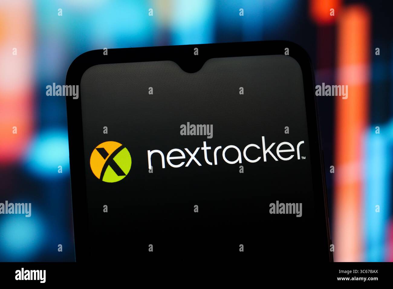 In this photo illustration, the Nextracker logo is seen displayed on a ...