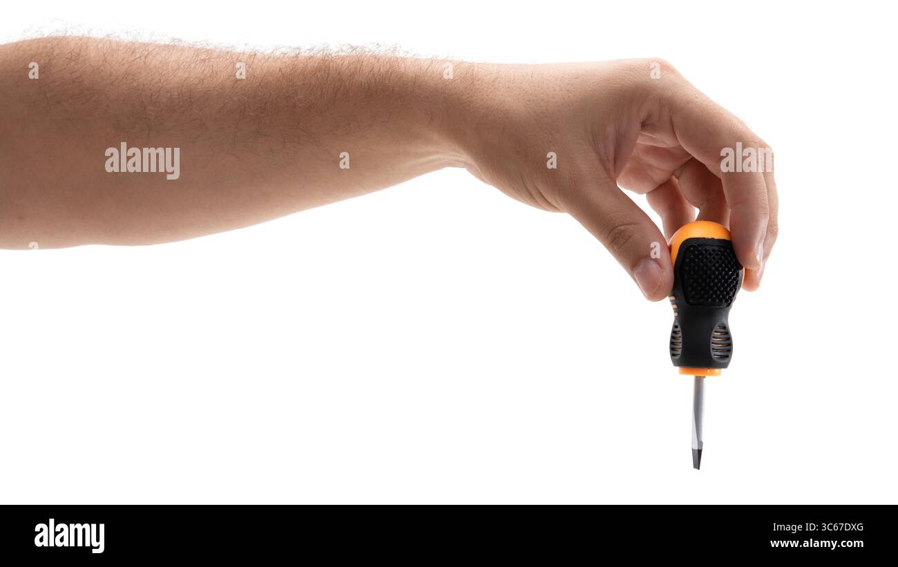 Hand holding a screwdriver for DIY tasks Stock Photo - Alamy