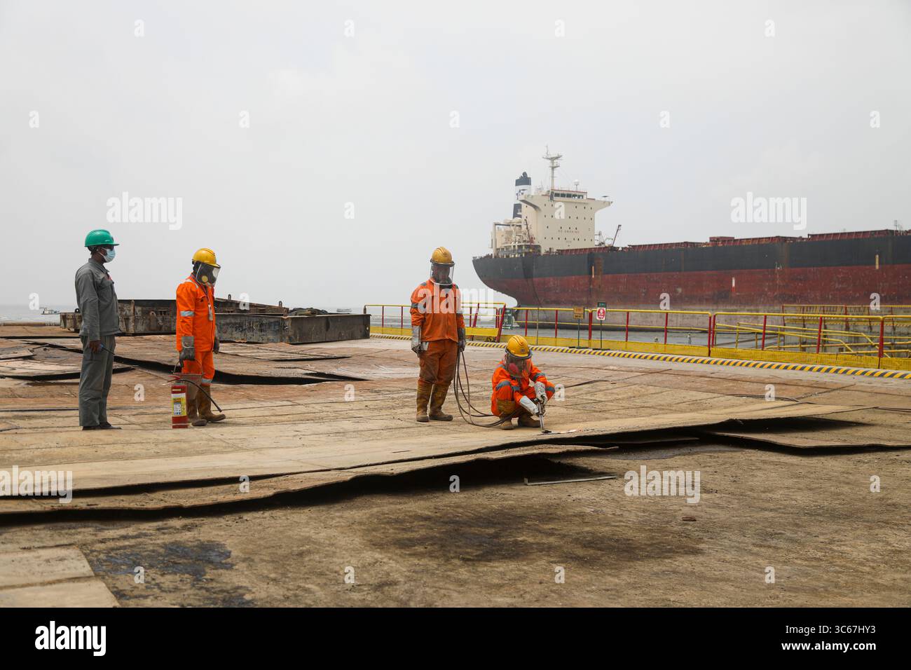 Workers at a green shipyard in Chattogram, Bangladesh, focus on safe ...