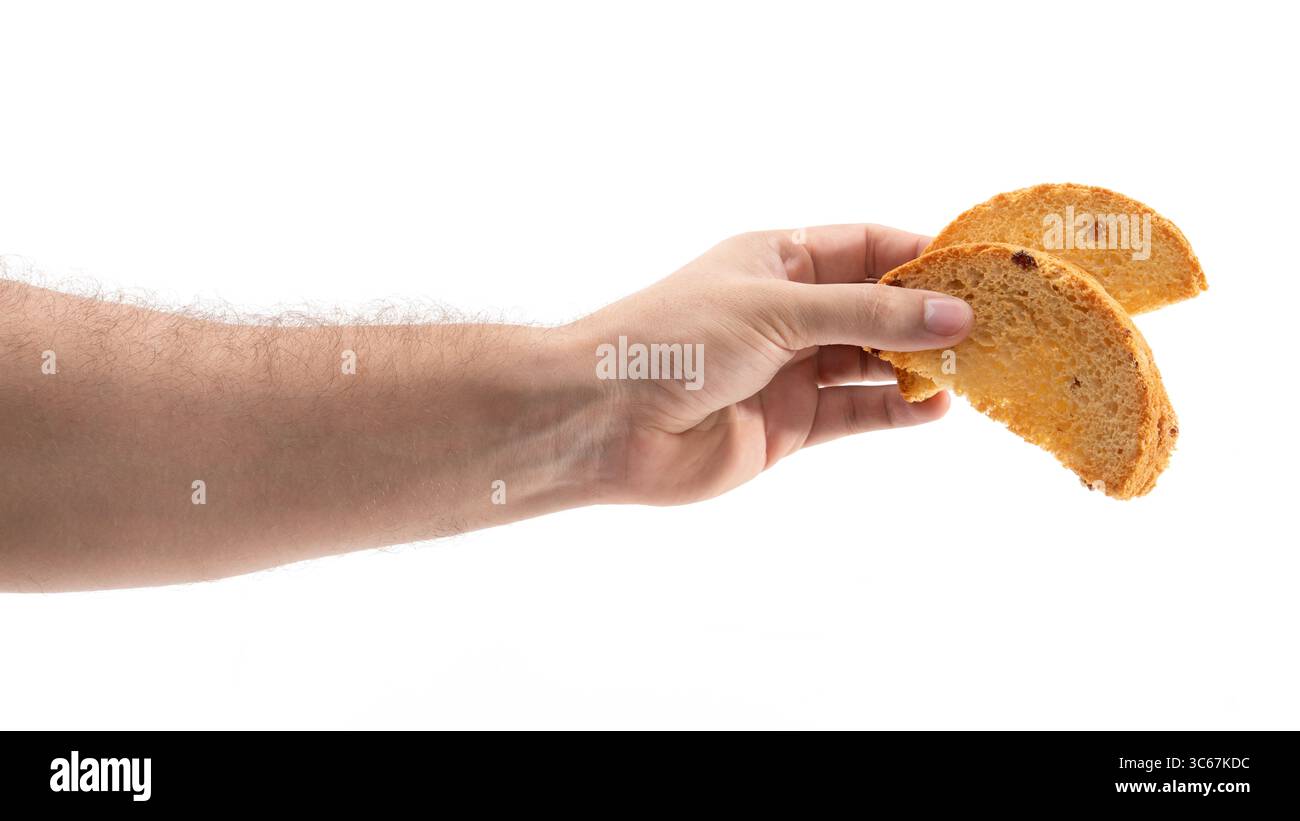 Hand holding two slices of toasted bread Stock Photo - Alamy