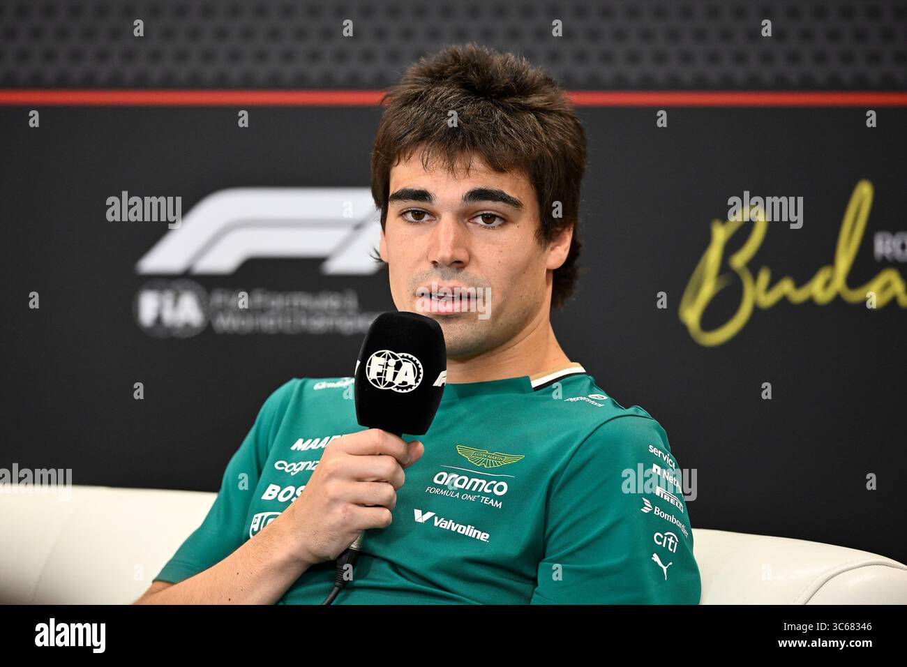Aston Martin driver Lance Stroll of Canada talks to the media at the ...