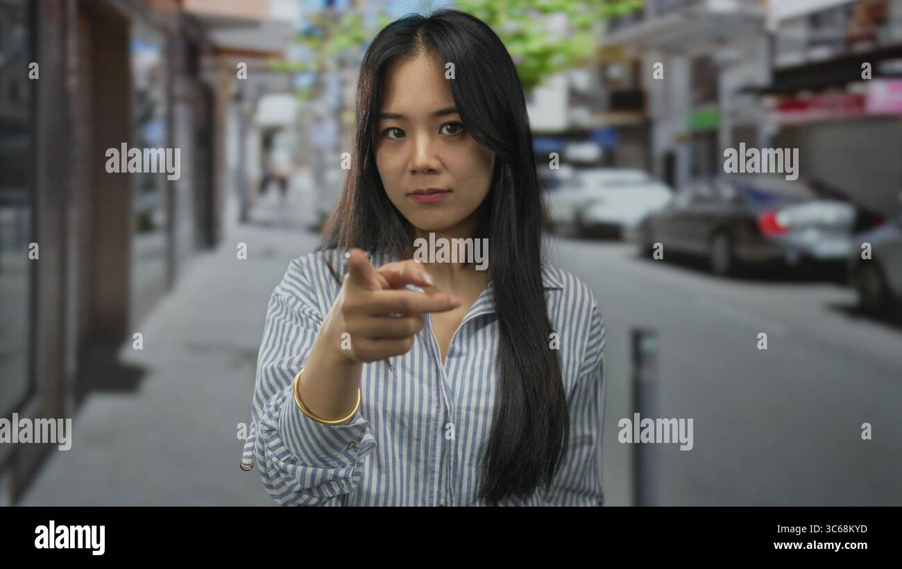 Woman pointing determination on bustling hi-res stock photography and ...